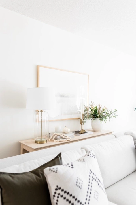 Console table behind couch against wall store